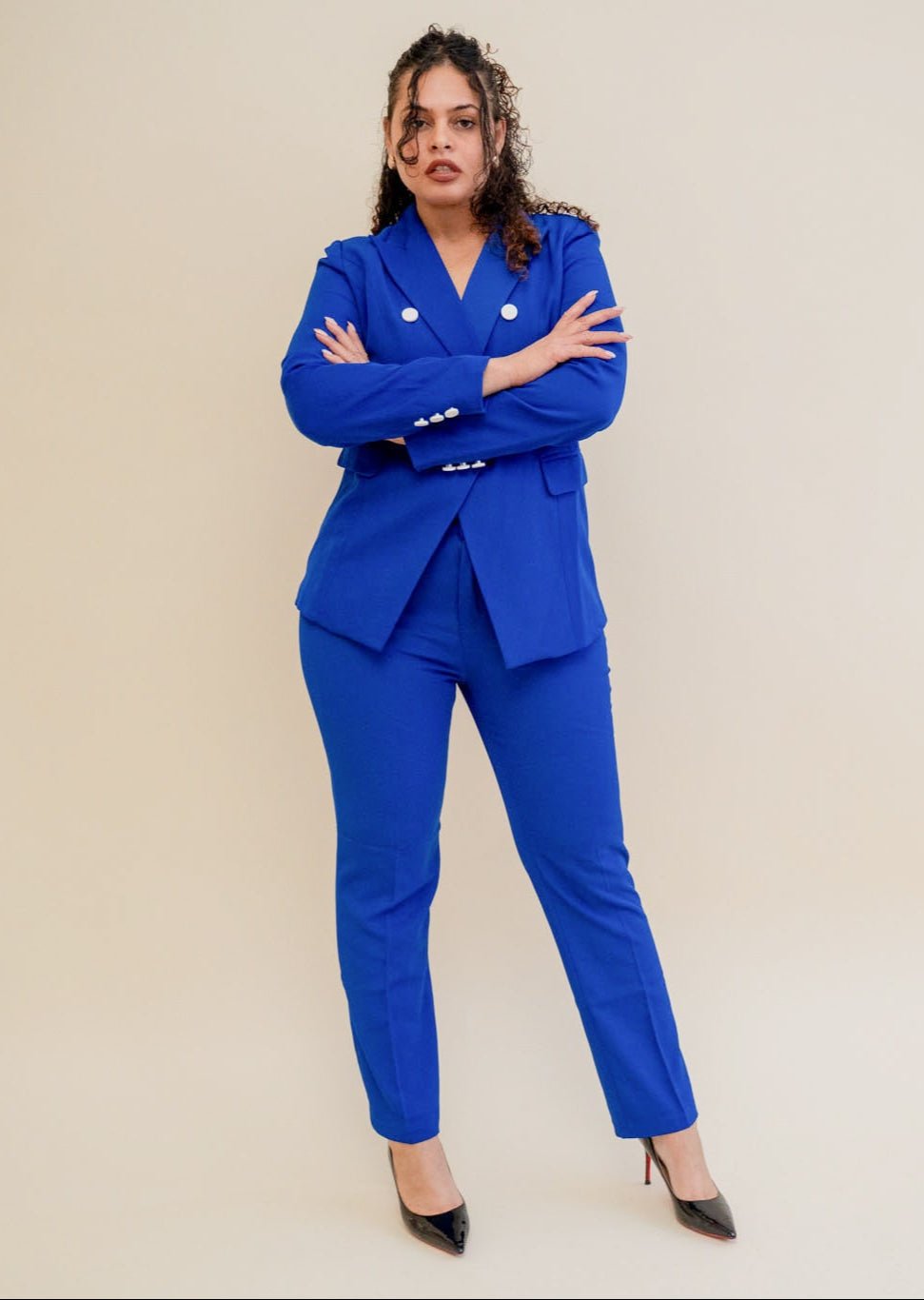 Royal blue 2 piece double breasted pants suit with contrast white buttons